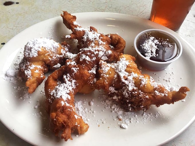 These beignets aren't just fried dough—they're little powdered pillows of joy that make you understand why New Orleans and Memphis have been engaged in a friendly pastry rivalry for decades.