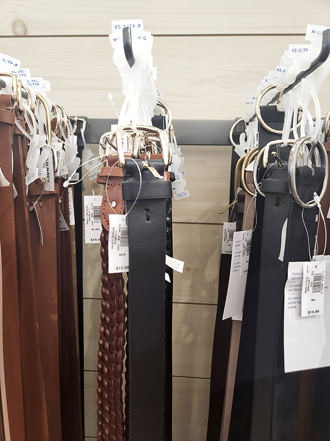 Leather belts hang like trophies of retail victory, each tag promising the thrill of getting premium accessories without the premium price tag.