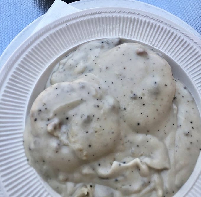Biscuits and gravy—the South's greatest contribution to breakfast civilization. This creamy, peppery blanket of comfort would make your grandmother proud.