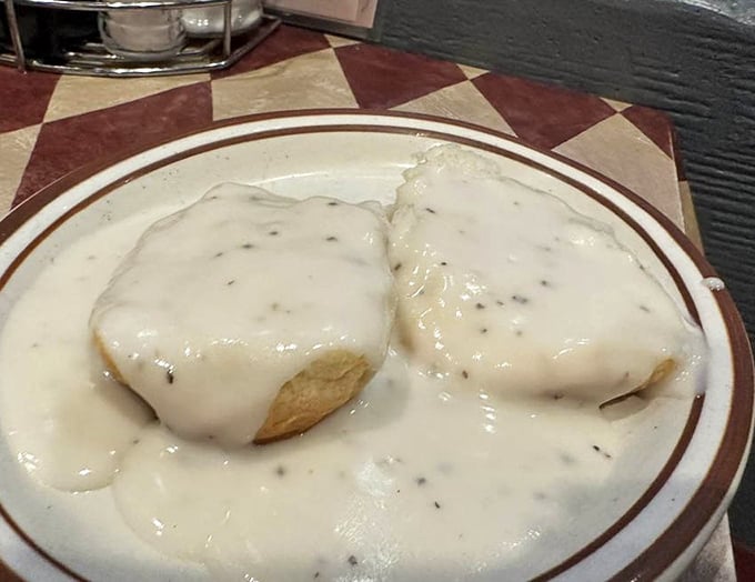 These biscuits and gravy aren't just a meal—they're a Southern handshake. Creamy, peppery gravy blanketing fluffy biscuits in a warm Tennessee embrace.
