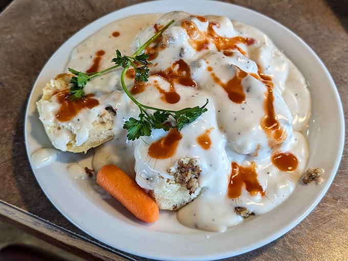 Biscuits swimming in creamy gravy with a splash of hot sauce—breakfast nirvana that makes morning people out of night owls.