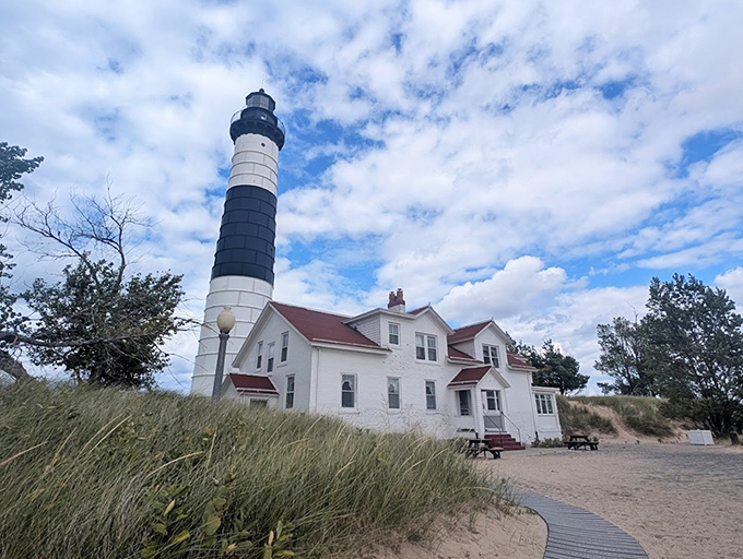 The distinctive striped pattern isn't just for looks—it's a "daymark" helping sailors identify which lighthouse they're seeing. Fashion meets function!