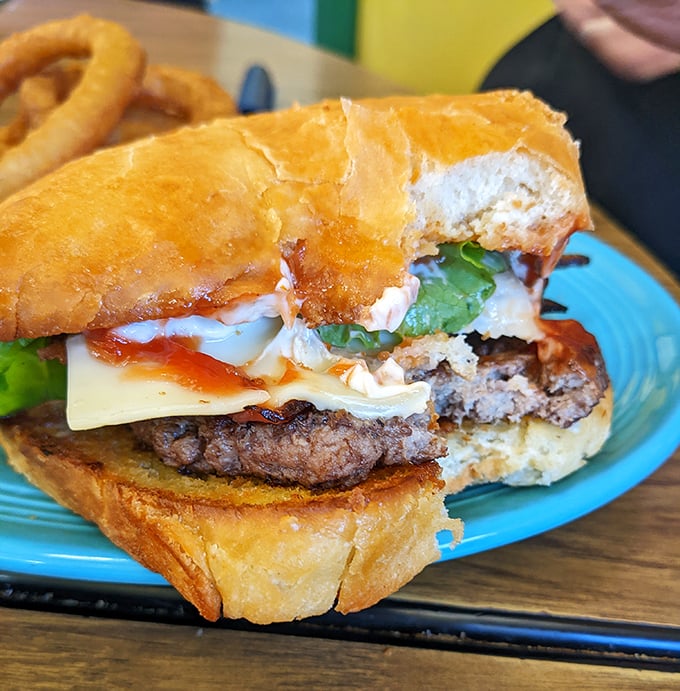 This isn't just a burger; it's an architectural marvel of beef, cheese, and fresh toppings on a homemade bun that puts fast food imposters to shame.