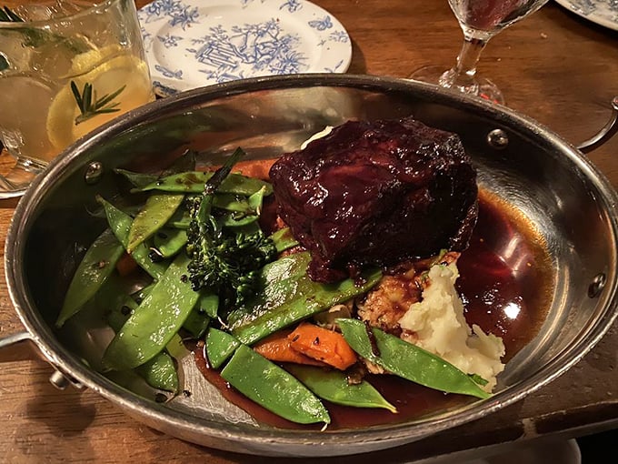 Braised beef so tender it surrenders to your fork without resistance, accompanied by vegetables that actually taste like themselves—a culinary miracle.