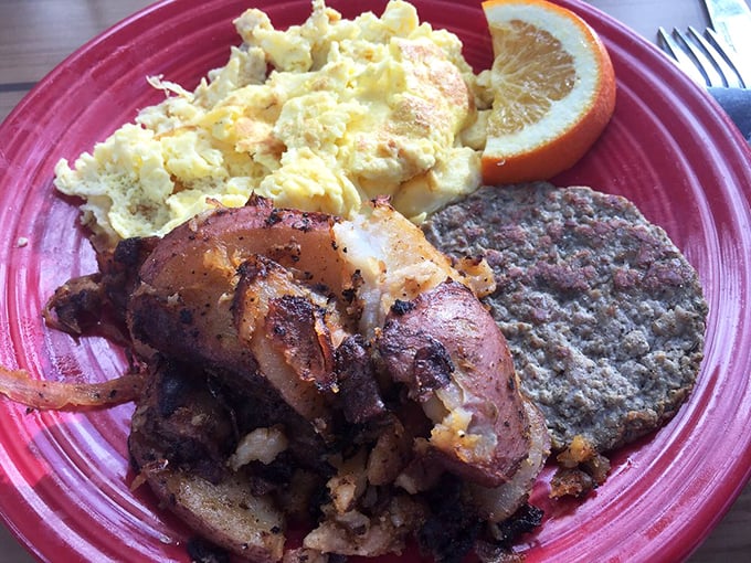 Morning glory on a plate! Perfectly scrambled eggs alongside home fries and sausage patty – the breakfast trifecta that makes getting out of bed worthwhile.