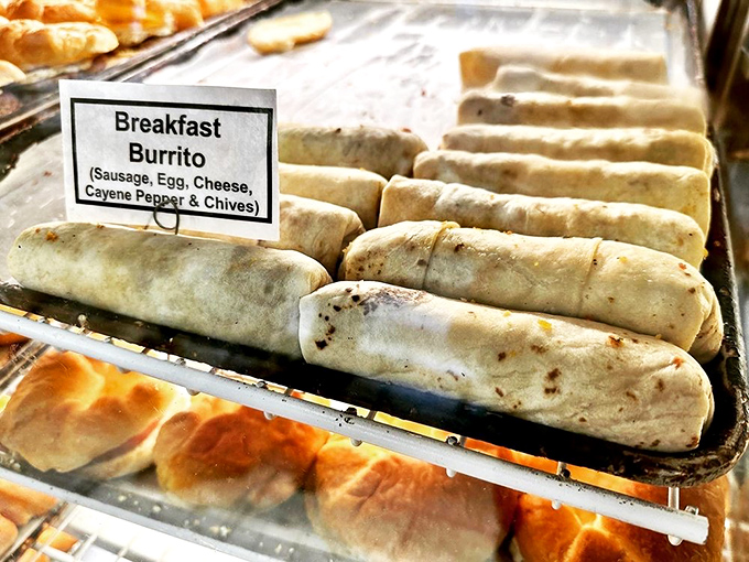 Breakfast burritos lined up like soldiers ready for duty – each one stuffed with a morning arsenal of eggs, sausage, and just enough spice.
