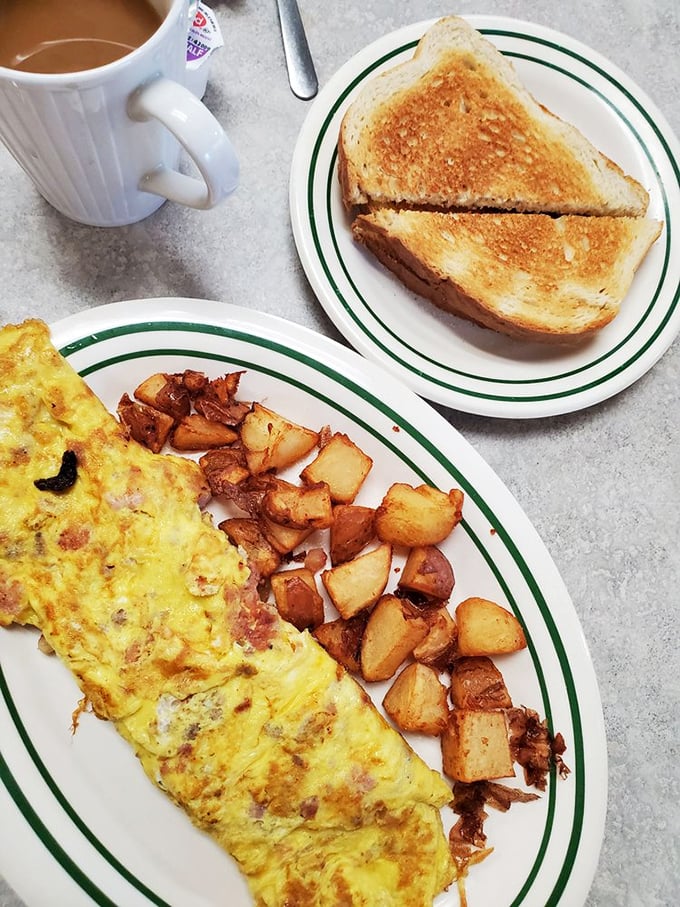 Breakfast perfection doesn't exi— Oh wait, here it is: a fluffy omelet alongside home fries that crackle with each bite and toast that's achieved golden nirvana.