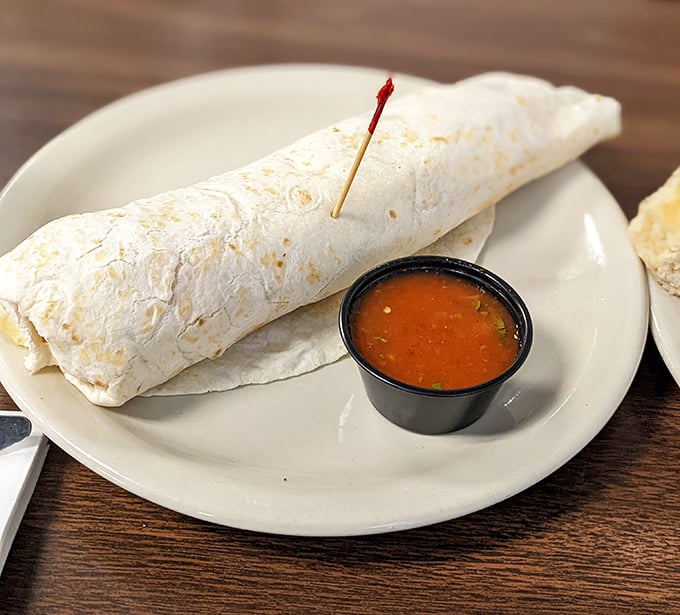 This breakfast burrito isn't messing around—stuffed with savory fillings and served with a side of salsa that'll wake you up faster than your morning coffee.