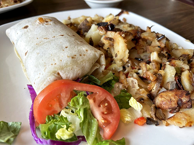 Breakfast wrapped in a neat little package. This burrito alongside perfectly crisped potatoes proves that good things come in simple presentations.