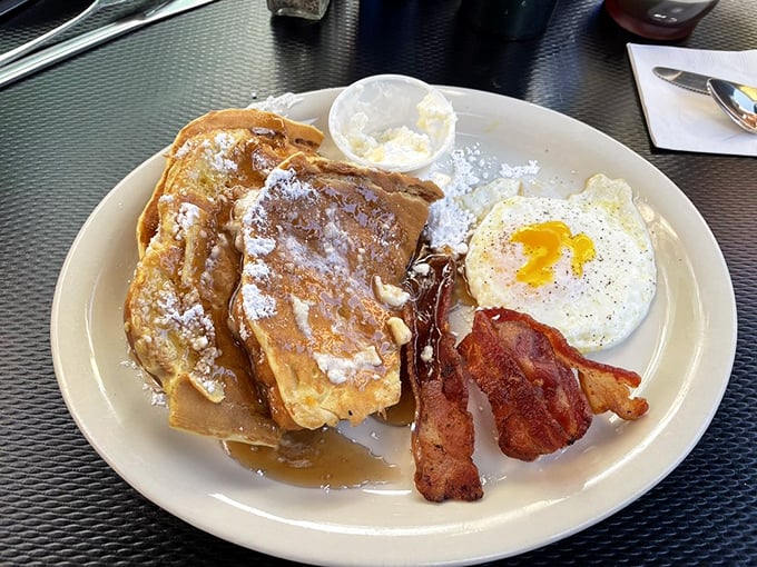 French toast, perfectly cooked eggs, and bacon that stands at attention—this is the breakfast trinity that launched a thousand surf sessions.