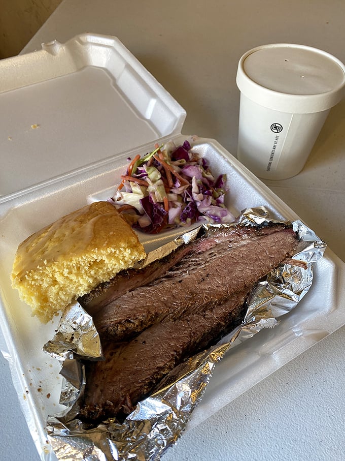 Brisket so tender it practically surrenders at the sight of your fork. Paired with golden cornbread and crisp slaw, it's the holy trinity of BBQ perfection.