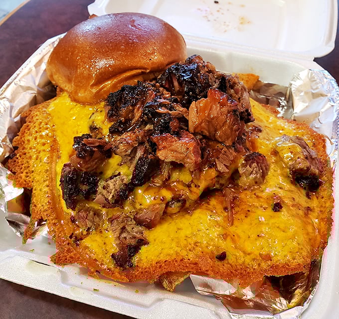 Barbecue alchemy: Transforming brisket into a towering masterpiece atop crispy cornbread. That cheese pull should have its own Instagram account.