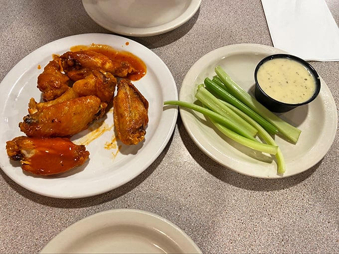 Buffalo wings that don't need a sporting event as an excuse. That vibrant orange sauce isn't just a color—it's a commitment to flavor that demands respect.