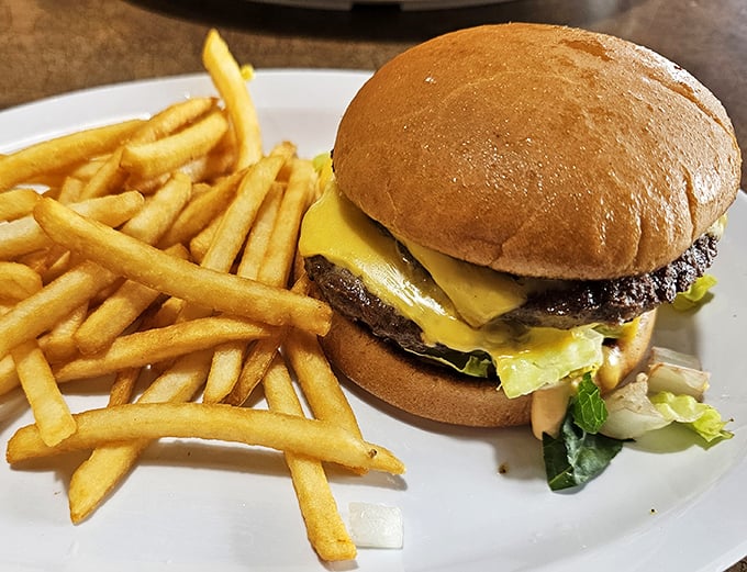 The classic American cheeseburger gets the diner treatment – unpretentious, perfectly melty, and proof that simplicity often trumps fancy culinary trends.