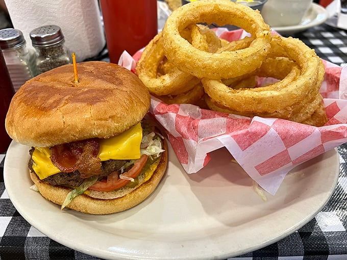 This isn't just a burger, it's an engineering marvel of beef, bacon and cheese that requires both hands and a strategic eating plan.