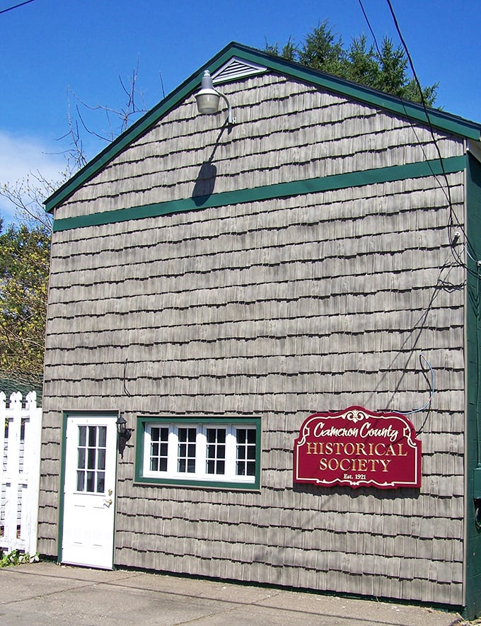 The Cameron County Historical Society's weathered wooden exterior houses treasures more valuable than gold—the authentic stories of generations past.