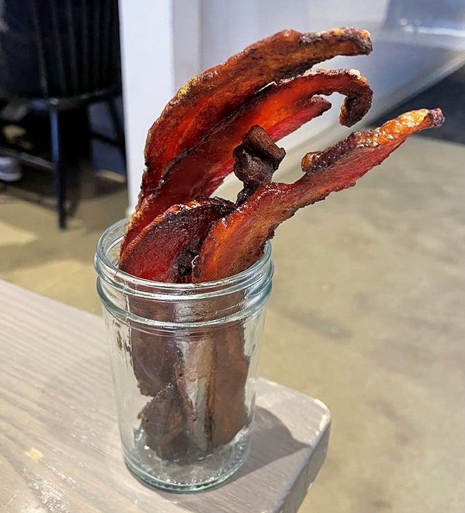 This isn't just bacon – it's candy in meat form, caramelized to sticky-sweet perfection and served in a jar like the treasure it is.