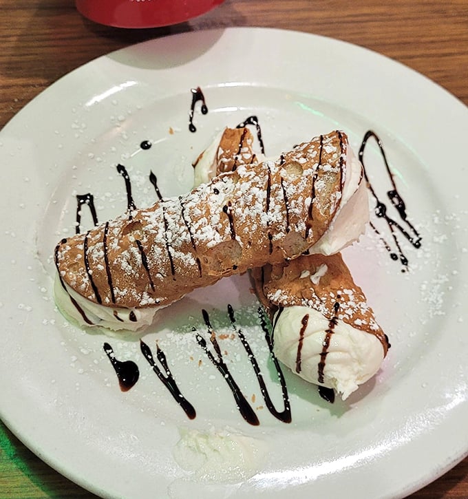 Cannoli that would make Don Corleone pause mid-sentence—crisp shells, creamy filling, and a dusting of powdered sugar that's an offer you can't refuse.