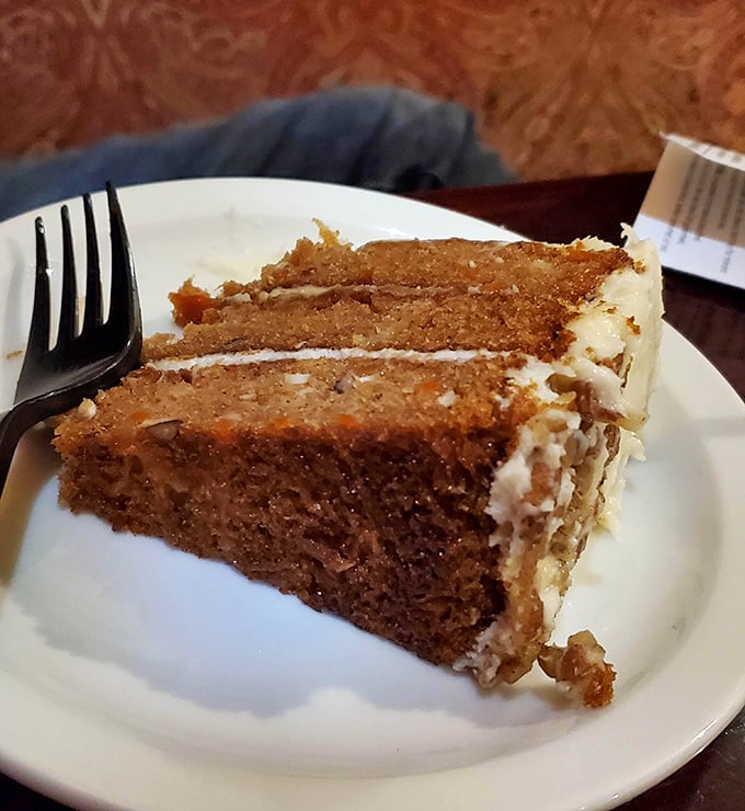 Carrot cake that actually makes you grateful for vegetables. Those layers are stacked higher than your weekend reading pile.