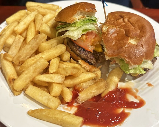 A burger that requires strategic planning before the first bite – architecture of flavor that's worth every napkin.