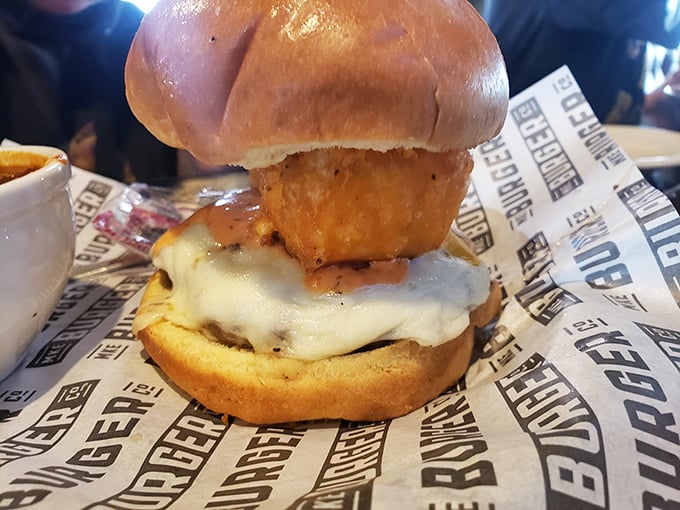 This isn't just a burger—it's architecture. The melted cheese cascades like a dairy waterfall over what can only be described as meat perfection.