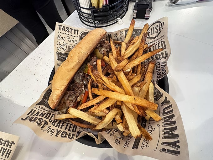 This isn't just a sandwich—it's an architectural marvel of beef, melted cheese, and perfectly golden fries that demands respect.