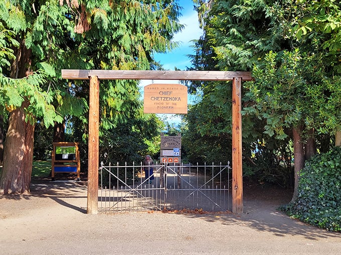 The entrance to Chetzemoka Park honors the S'Klallam chief while inviting visitors to discover gardens, picnic spots, and beach access beyond its rustic wooden gateway.