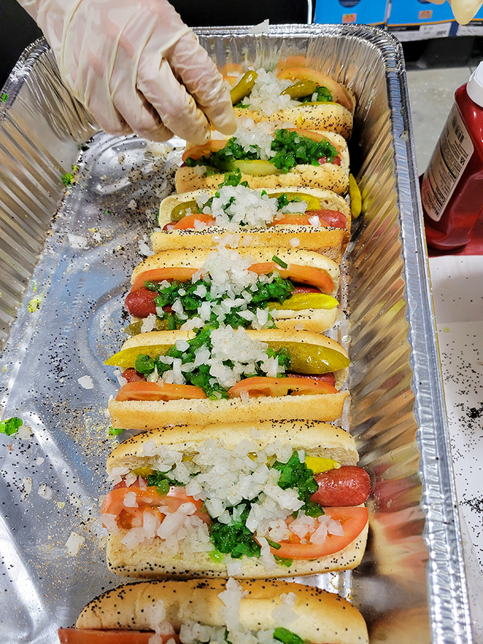 Chicago dogs lined up like soldiers ready for duty – each one a perfect symphony of toppings where ketchup dare not tread.