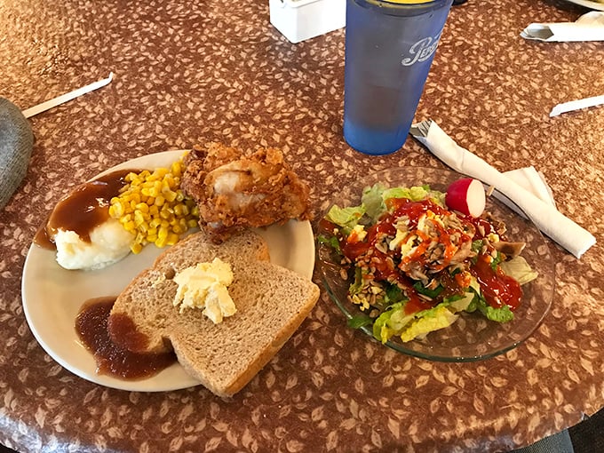 A plate that tells the story of American comfort food better than any cookbook. That fried chicken leg is practically begging to be photographed.