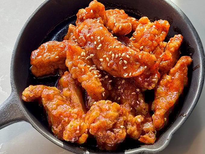 Korean fried chicken that makes the Colonel jealous – crispy, glazed, and absolutely impossible to share.