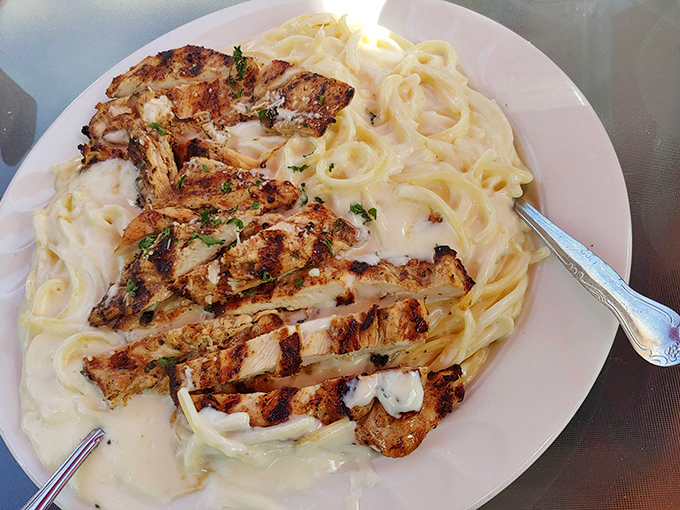 Fettuccine Alfredo that puts chain restaurants to shame. This isn't that gloppy stuff from the mall—it's silky, buttery pasta heaven on a plate.