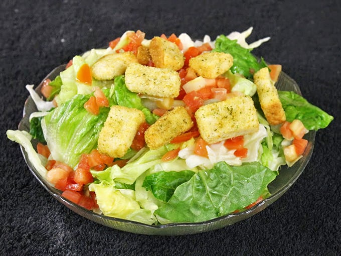 Even the salad game is strong here – crisp romaine, fresh tomatoes, and house-made croutons that put sad drive-thru salads to absolute shame.