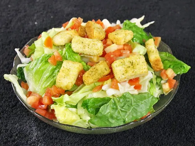 Even the salad game is strong here – crisp romaine, fresh tomatoes, and house-made croutons that put sad drive-thru salads to absolute shame.
