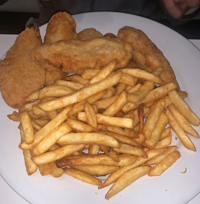 Crispy on the outside, tender within—the universal language of comfort. These golden chicken tenders and perfectly cooked fries speak directly to your inner child.