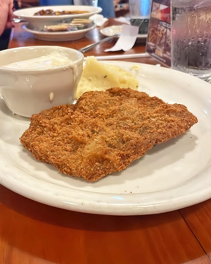 Golden-fried perfection meets creamy country gravy. This chicken fried steak isn't just comfort food—it's a warm hug from the Heartland itself.
