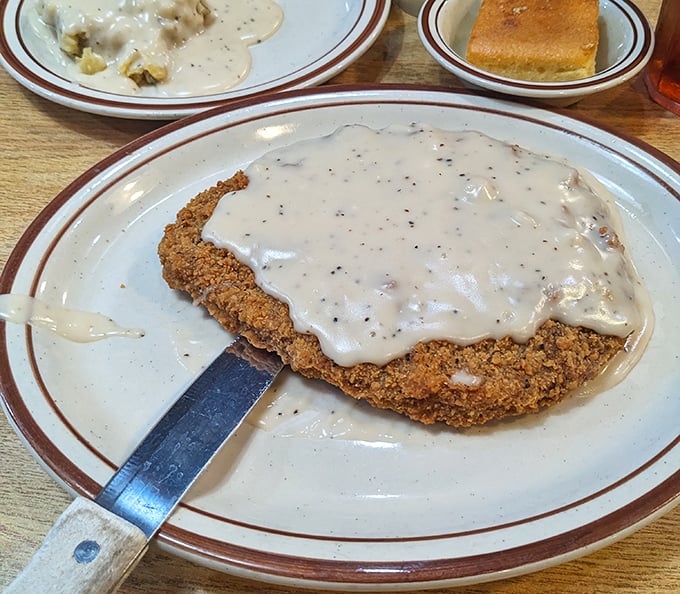 Country-fried steak smothered in gravy – the breakfast equivalent of a warm hug from your favorite aunt who never counted calories.