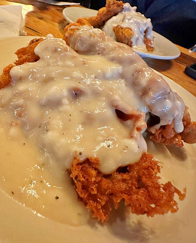 Chicken fried steak swimming in creamy gravy—the South's answer to comfort food that hugs your insides like a warm blanket on a cold day.