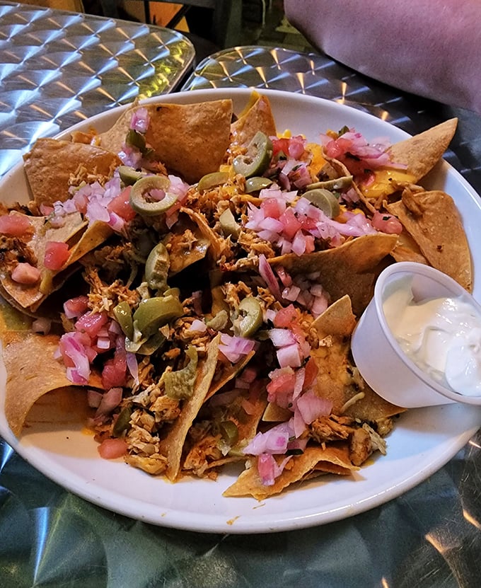 Nachos that don't know the meaning of "skimpy." Every chip is a treasure hunt of pulled pork, jalapeños, and fresh toppings.
