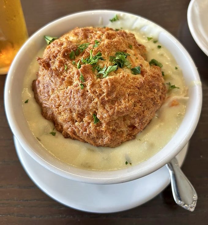 This isn't just soup—it's comfort in a bowl, topped with a golden biscuit that deserves its own fan club and Instagram account.