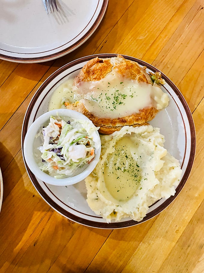 This chicken pot pie isn't just dinner—it's a hug on a plate, with its golden crown of pastry hiding a steamy treasure of comfort below.