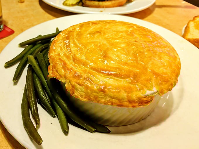 Golden, flaky crust hiding savory treasures beneath – this chicken pot pie isn't just comfort food, it's a warm hug for your taste buds.