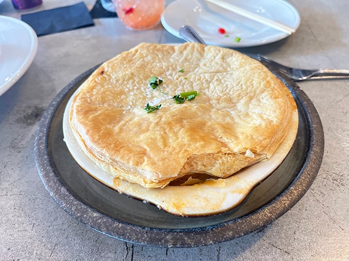 Golden, flaky pastry hiding treasures beneath. This savory pie doesn't just break when your fork hits—it practically sings with buttery delight.