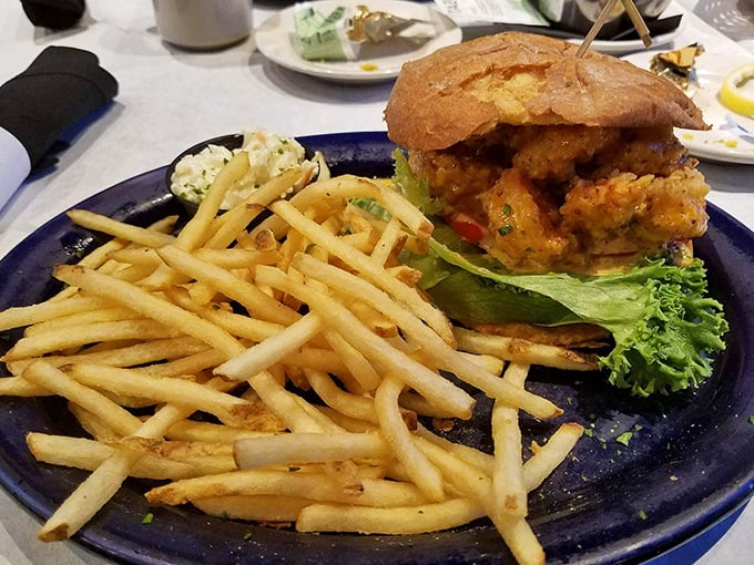 This isn't just a sandwich; it's a towering achievement of crispy chicken, fresh greens, and pillowy bread that demands a two-handed salute.