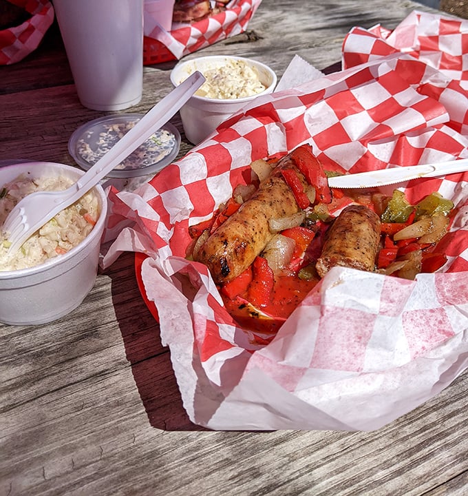 Grilled sausages nestled among peppers and onions—proof that sometimes the simple things in life truly are the most magnificent.