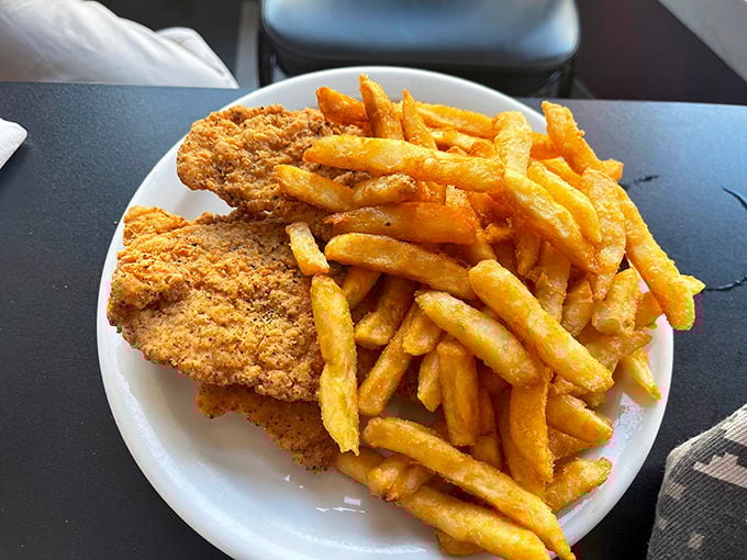 Golden-brown chicken tenders with crispy fries—proof that sometimes the simplest pleasures are the most satisfying.