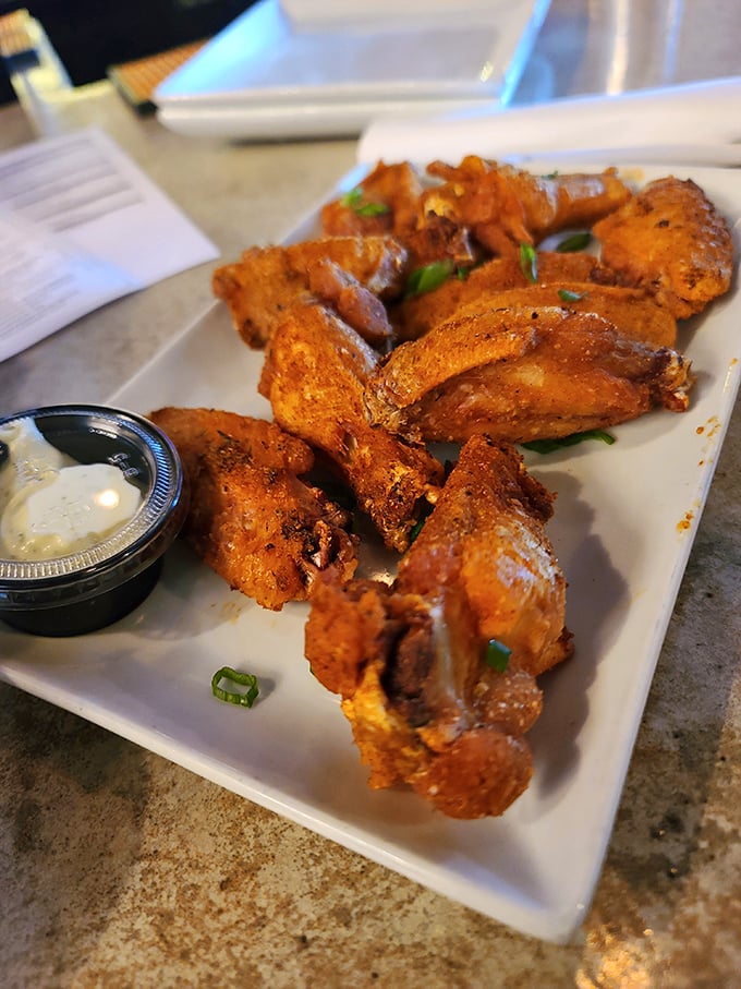 These wings wear their glaze like a badge of honor, crispy and sauced just right for serious flavor.