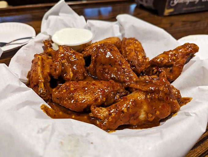 These wings aren't just cooked – they're transformed. Glistening with sauce and promising the perfect balance of heat and sweet.