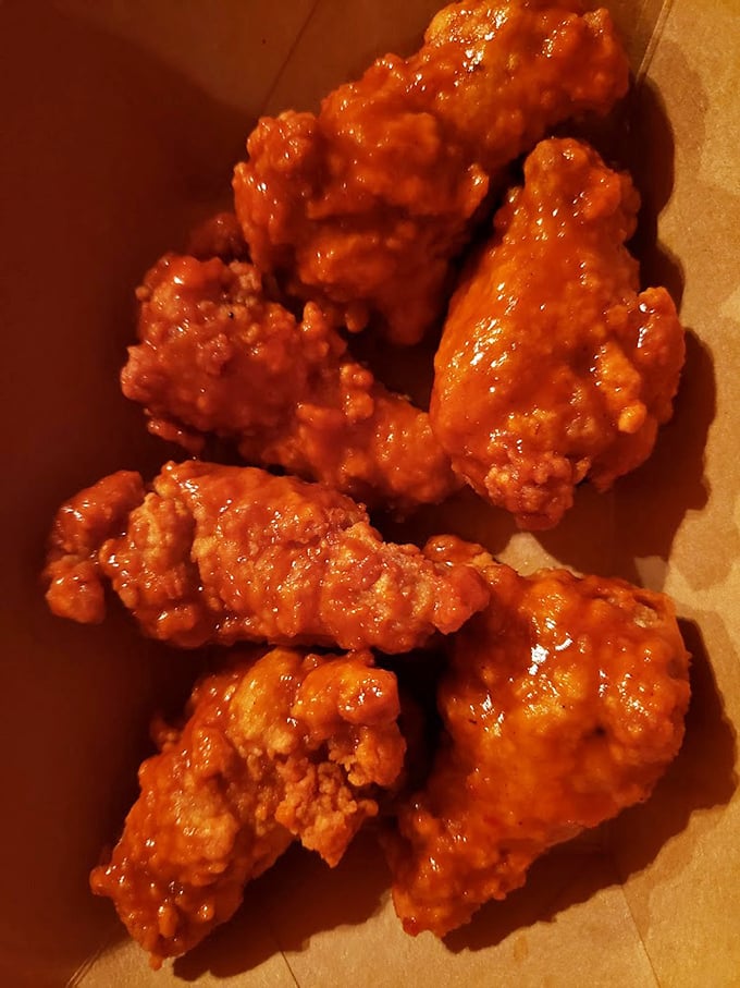 These wings aren't just coated in sauce—they're having a full-on flavor affair with it. Napkins required, regrets impossible.