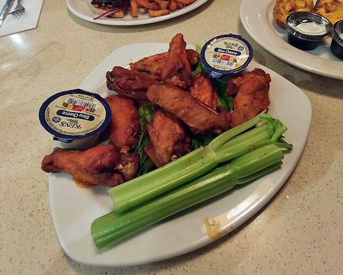 Buffalo wings that make you understand why humans evolved opposable thumbs. Crispy, saucy, with celery standing by for moral support.