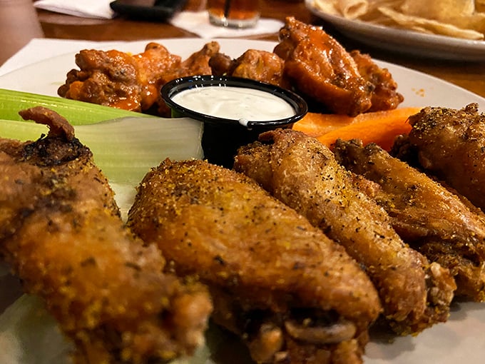These wings aren't just cooked, they're transformed – crispy, saucy battalions lined up and ready for their delicious sacrifice.
